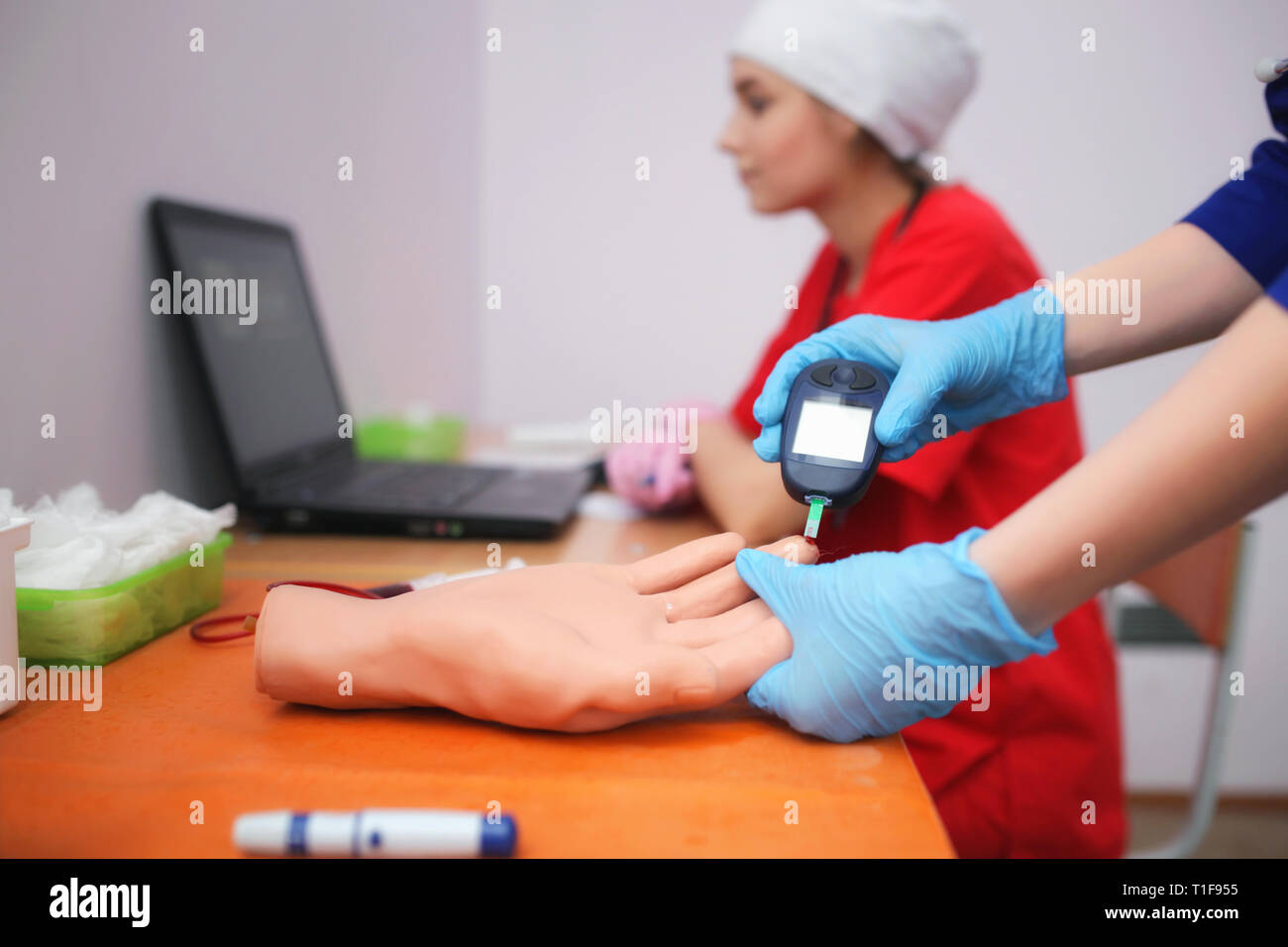 medical student takes blood test dummy. Training doctors university ...