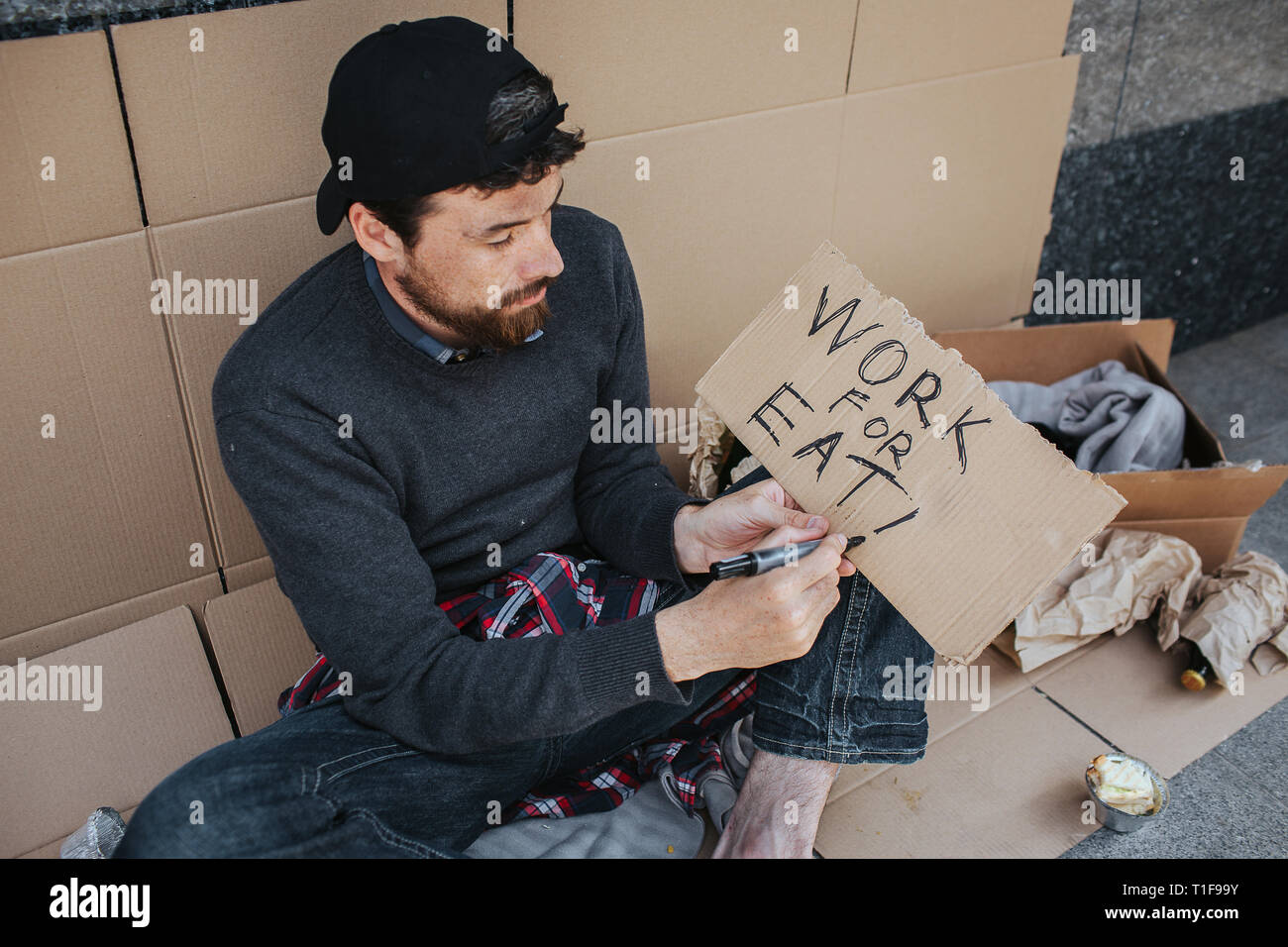 Homeless guy by bank hi-res stock photography and images - Alamy
