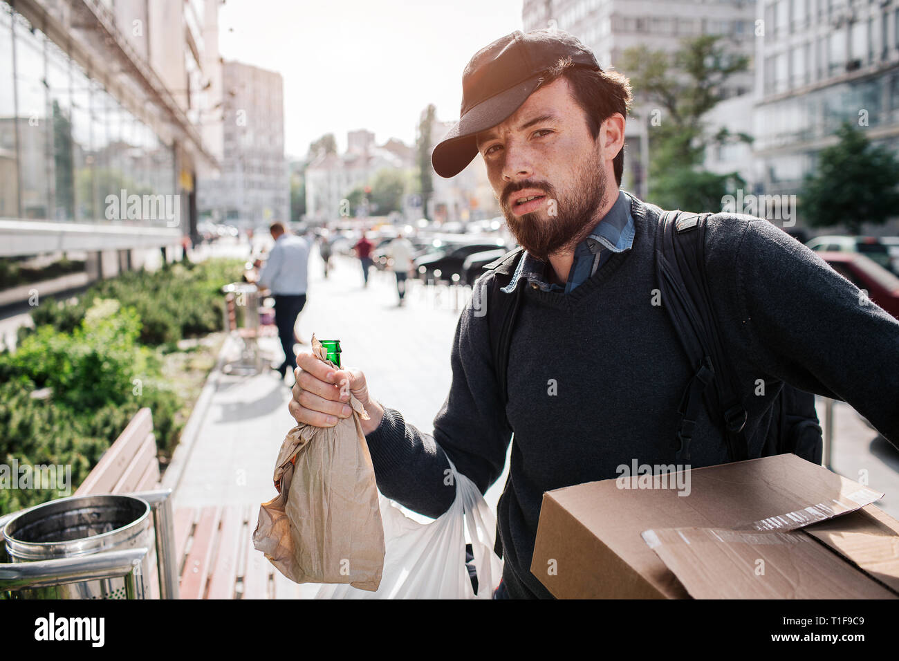 Homeless man standing on street hi-res stock photography and images - Alamy
