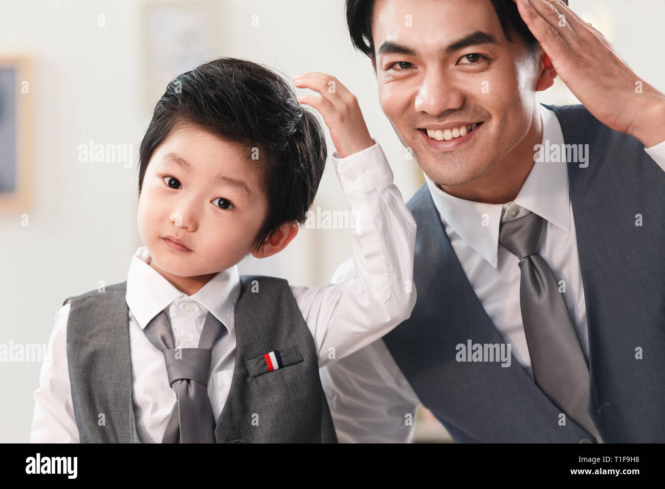 Dress up the father and son Stock Photo - Alamy