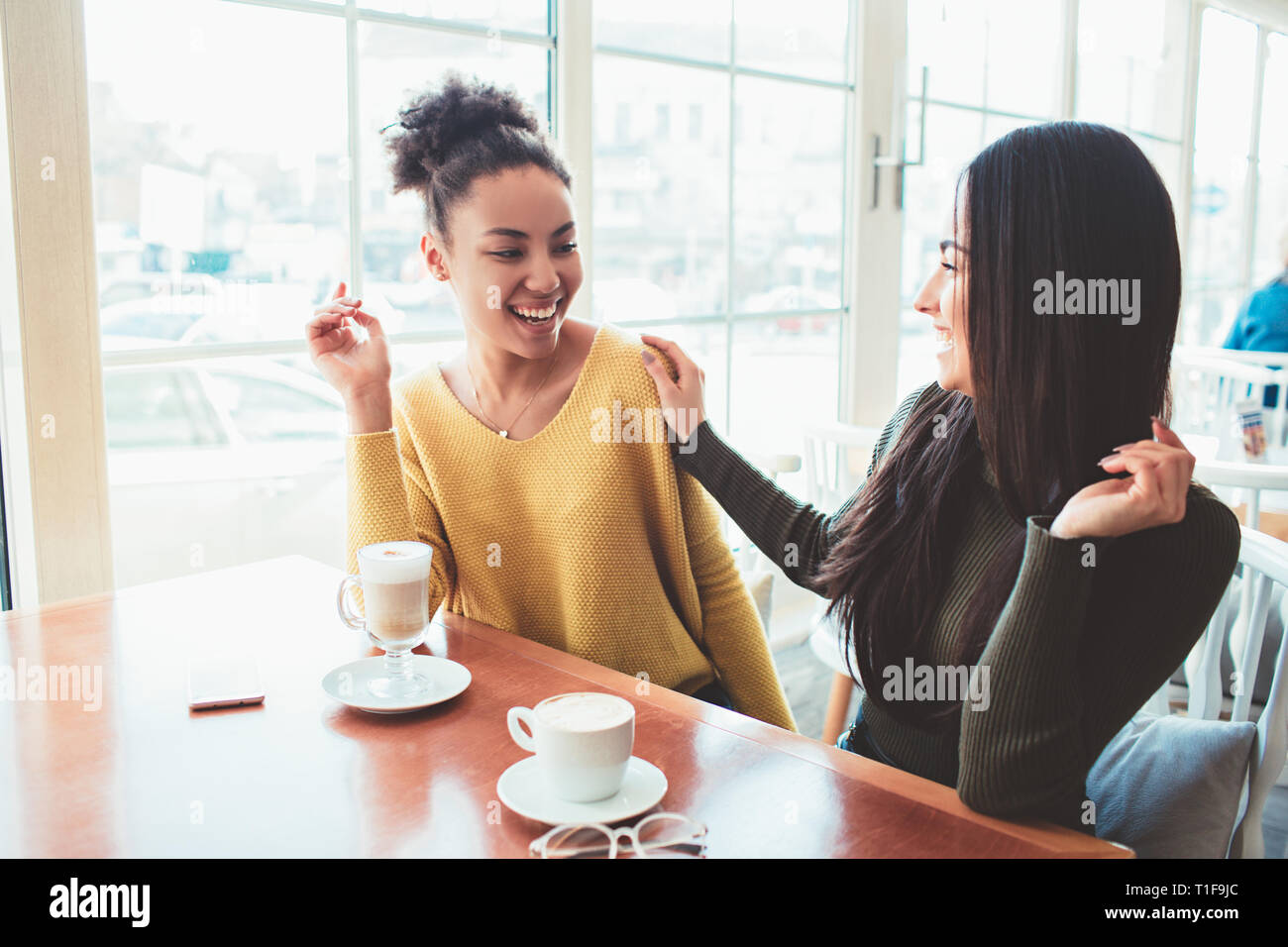 Girls in cafe Stock Photo - Alamy
