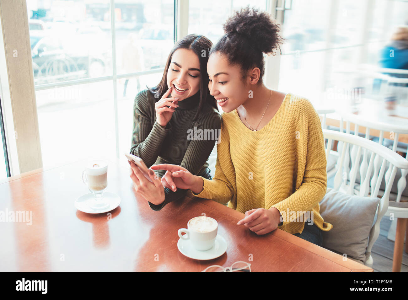 Girls in cafe Stock Photo - Alamy