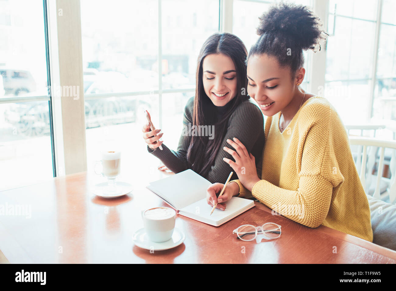Girls in cafe Stock Photo - Alamy