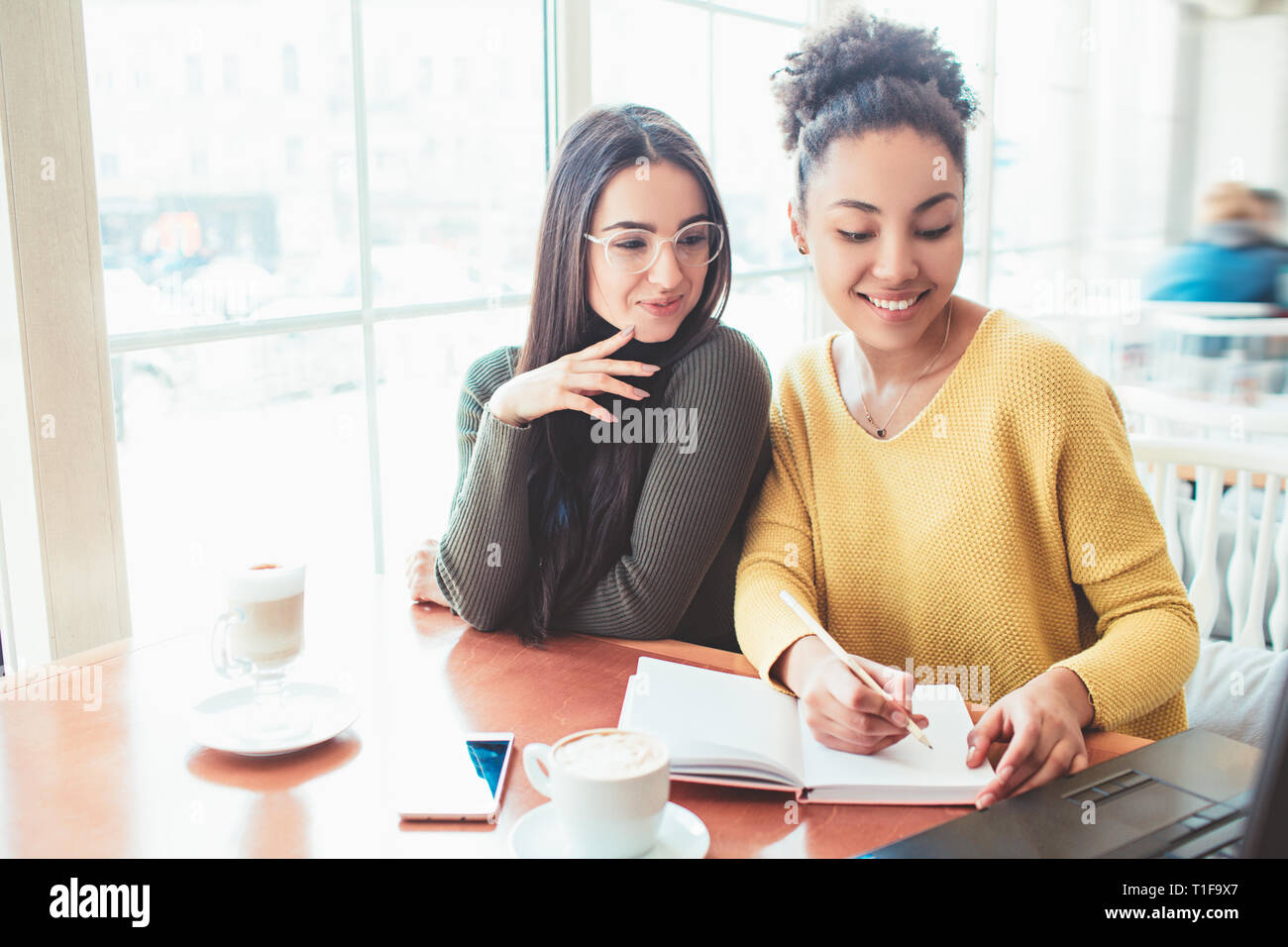 Girls in cafe Stock Photo - Alamy