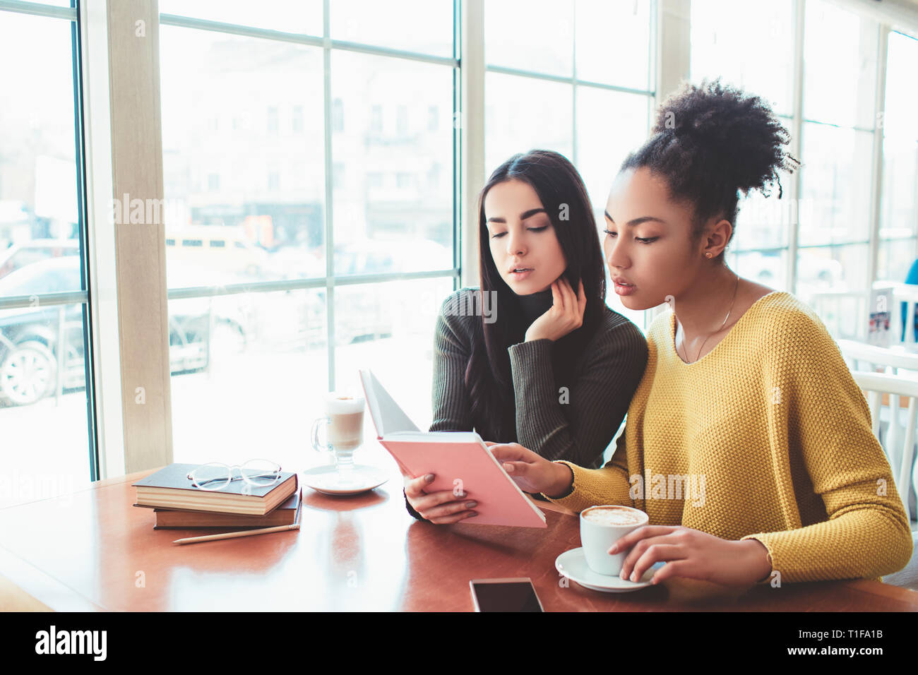 Girls in cafe Stock Photo - Alamy