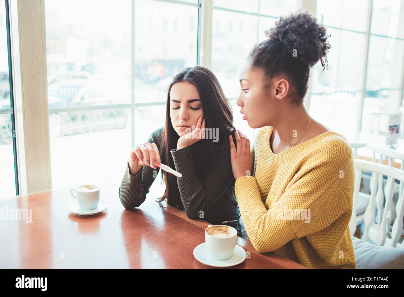 Girls in cafe Stock Photo - Alamy