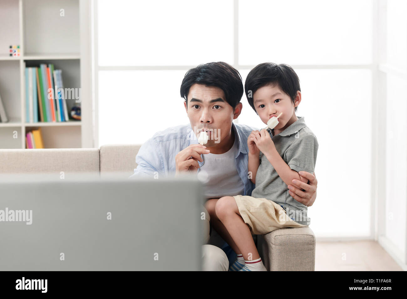 Happy father and son was watching TV Stock Photo - Alamy
