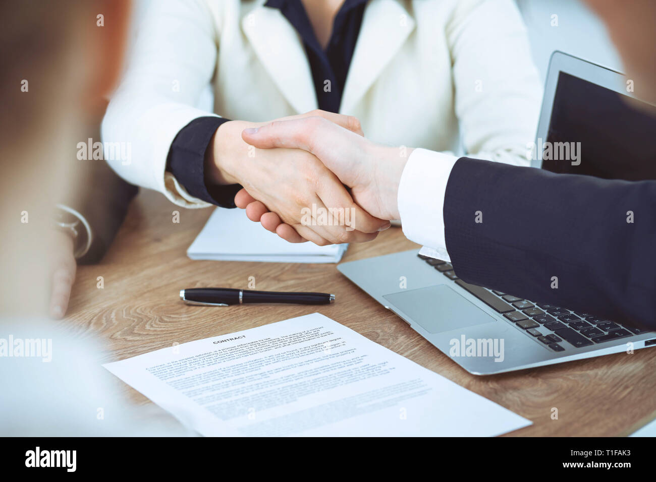 Business people shaking hands at meeting or negotiation in the office ...