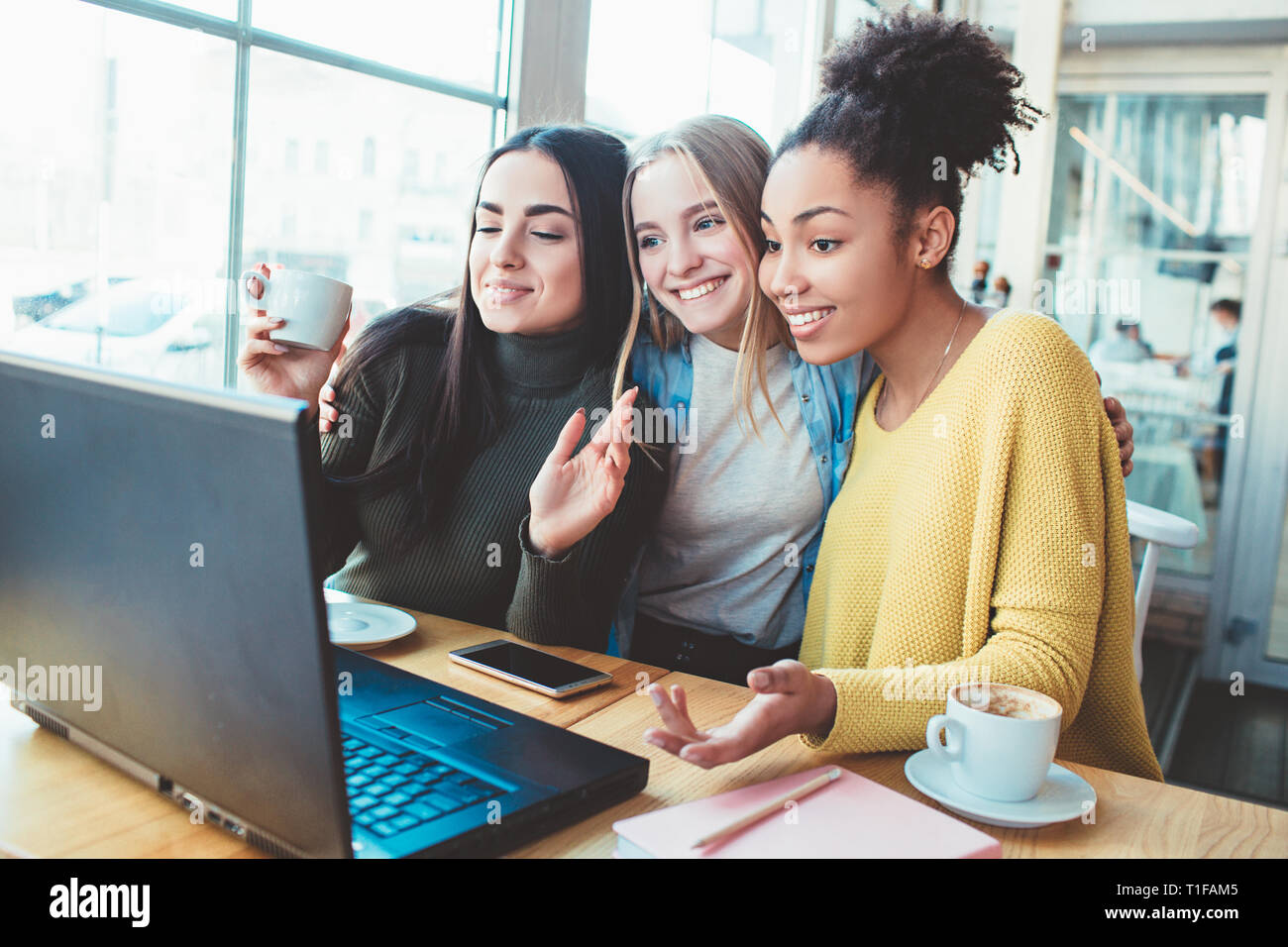 Girls in cafe Stock Photo - Alamy