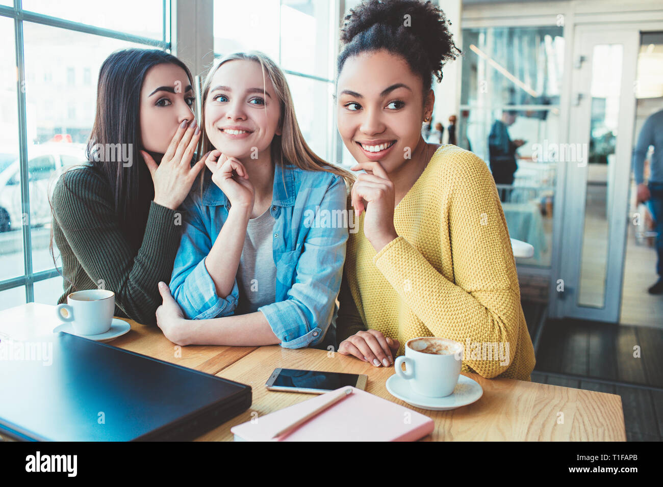 Three students cafe hi-res stock photography and images - Alamy