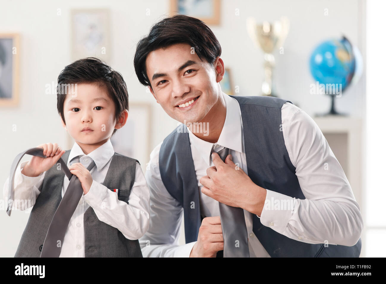Dress up the father and son Stock Photo - Alamy