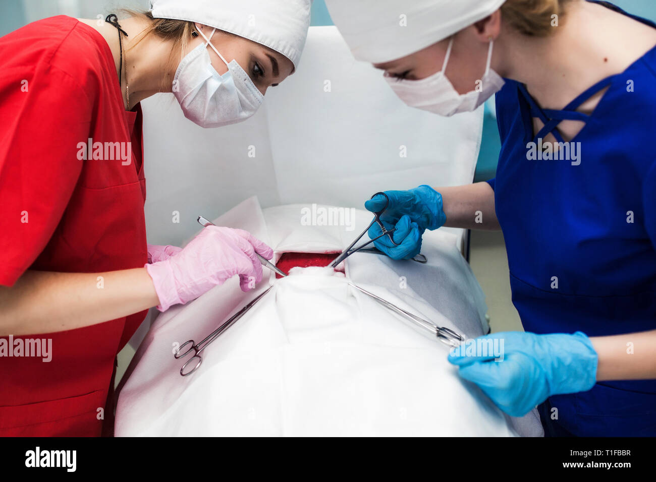 group of medical students practiced in an operation on a dummy. Young ...