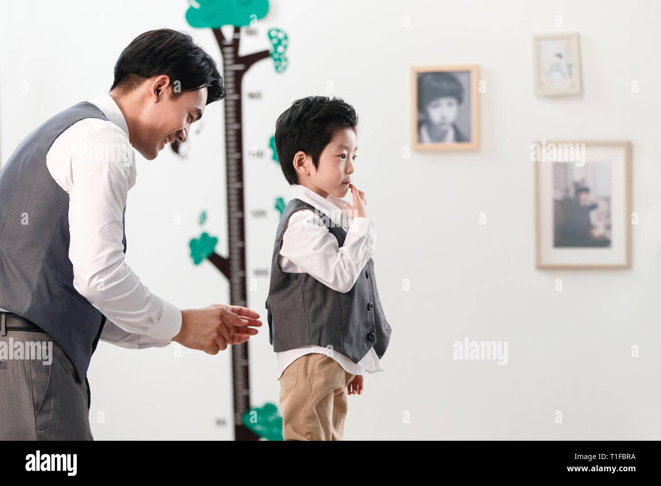 Child getting dressed asia hi-res stock photography and images - Alamy