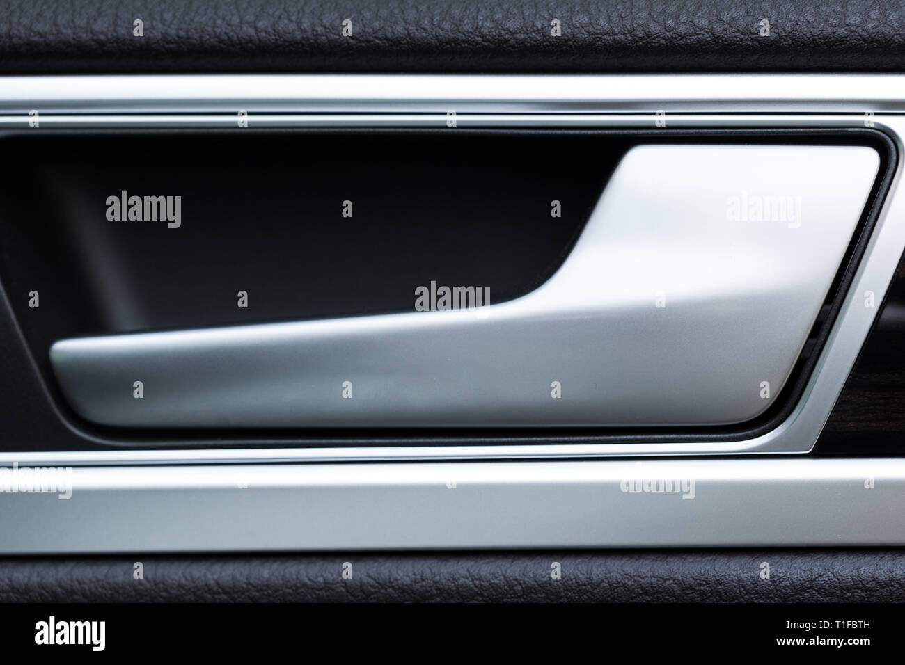 Inner door handle, modern car interior detail Stock Photo - Alamy