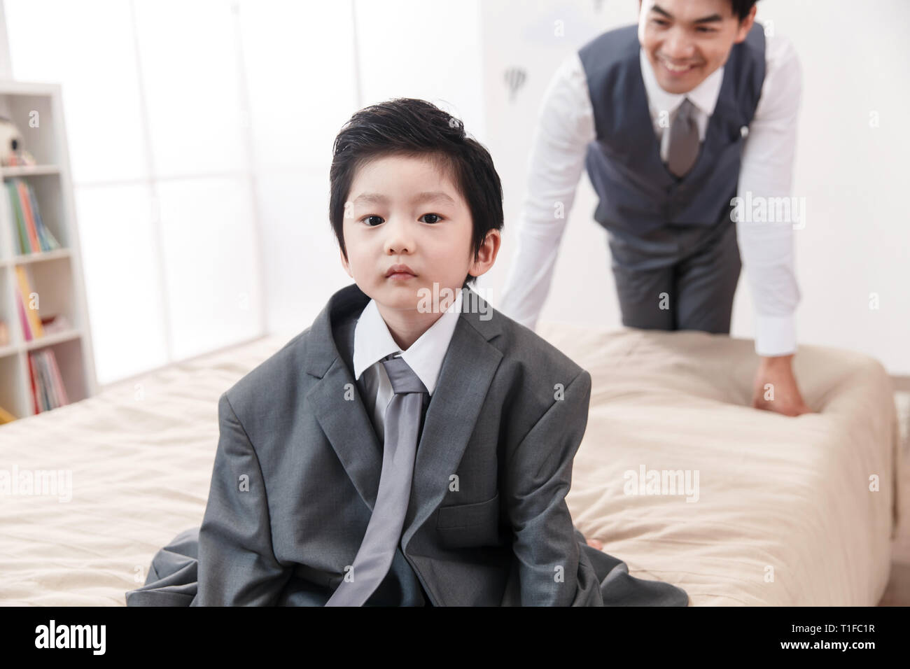 Dress up the father and son Stock Photo - Alamy
