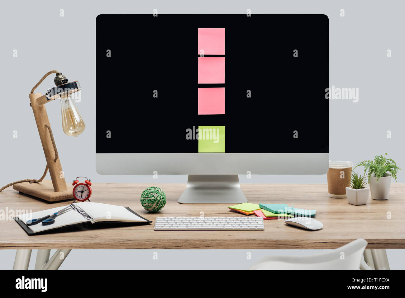 modern workplace with computer monitor with sticky notes and stationery ...