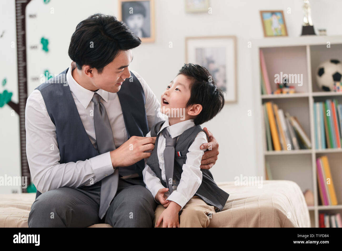 Dress up the father and son Stock Photo - Alamy