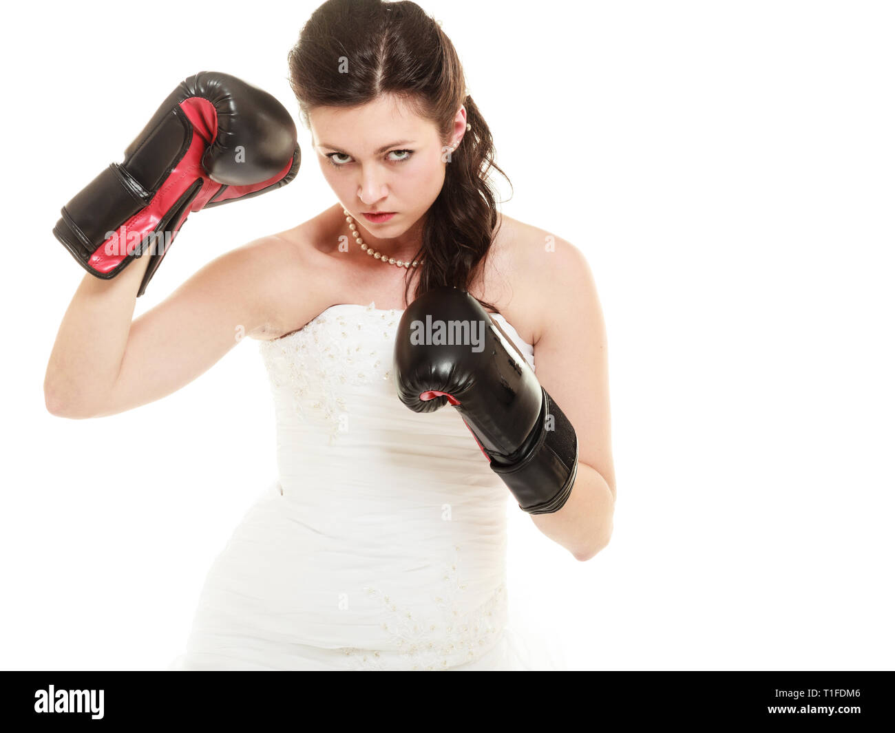 Emancipation. Bride in wedding dress wearing boxing gloves. Woman ...