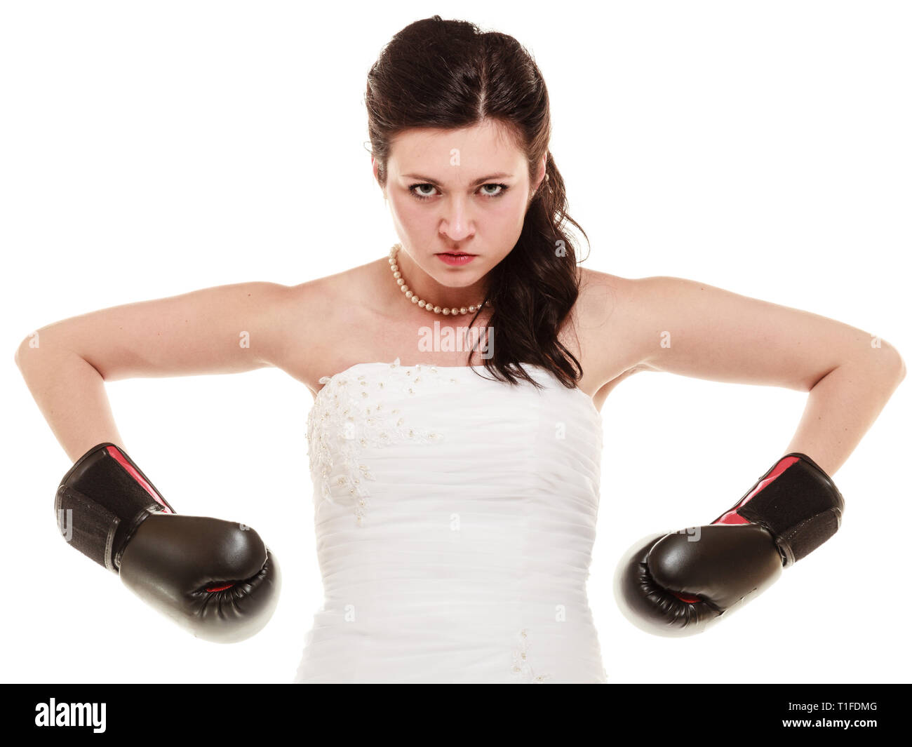 Emancipation. Bride in wedding dress wearing boxing gloves. Woman ...
