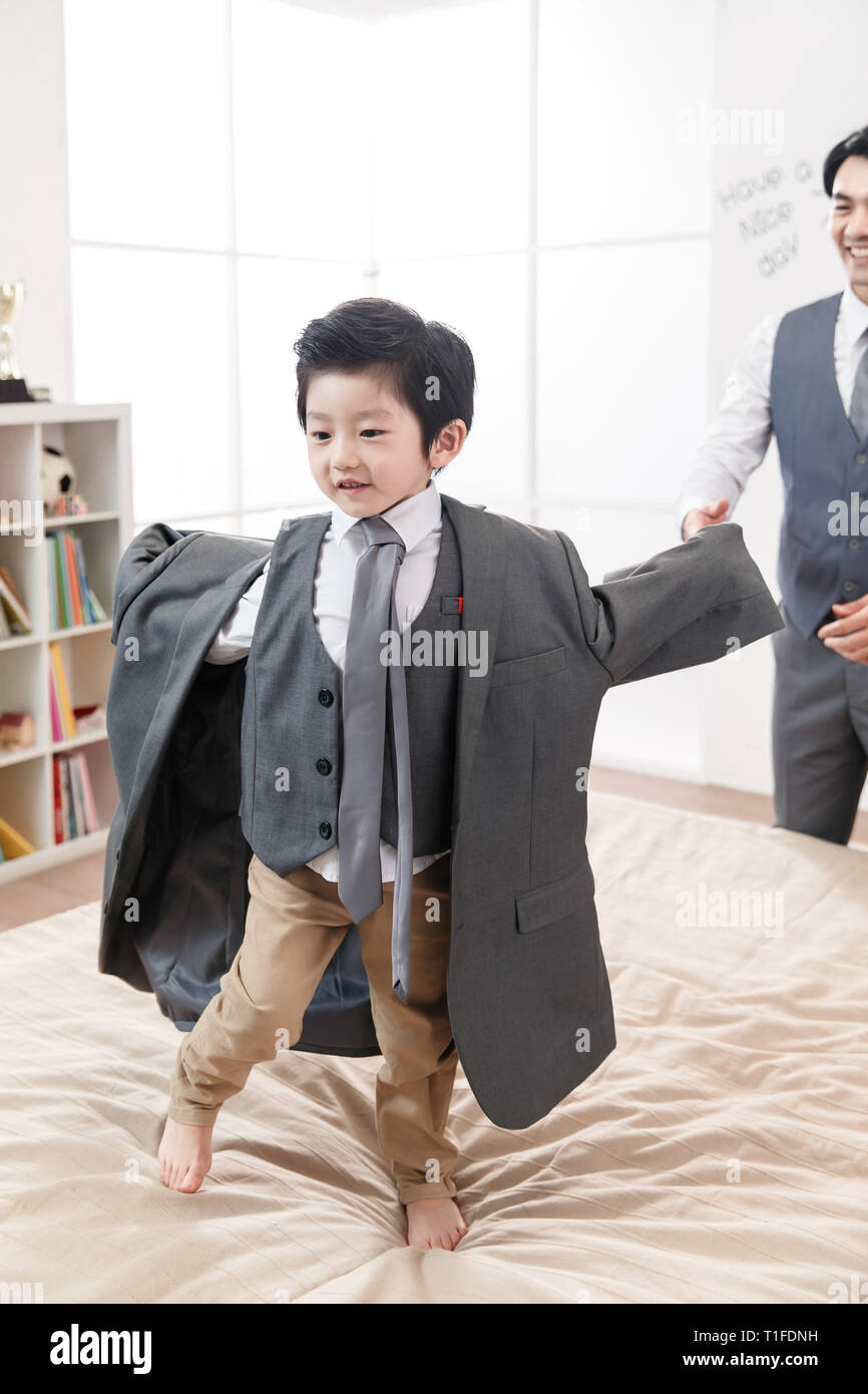 Dress up the father and son Stock Photo - Alamy