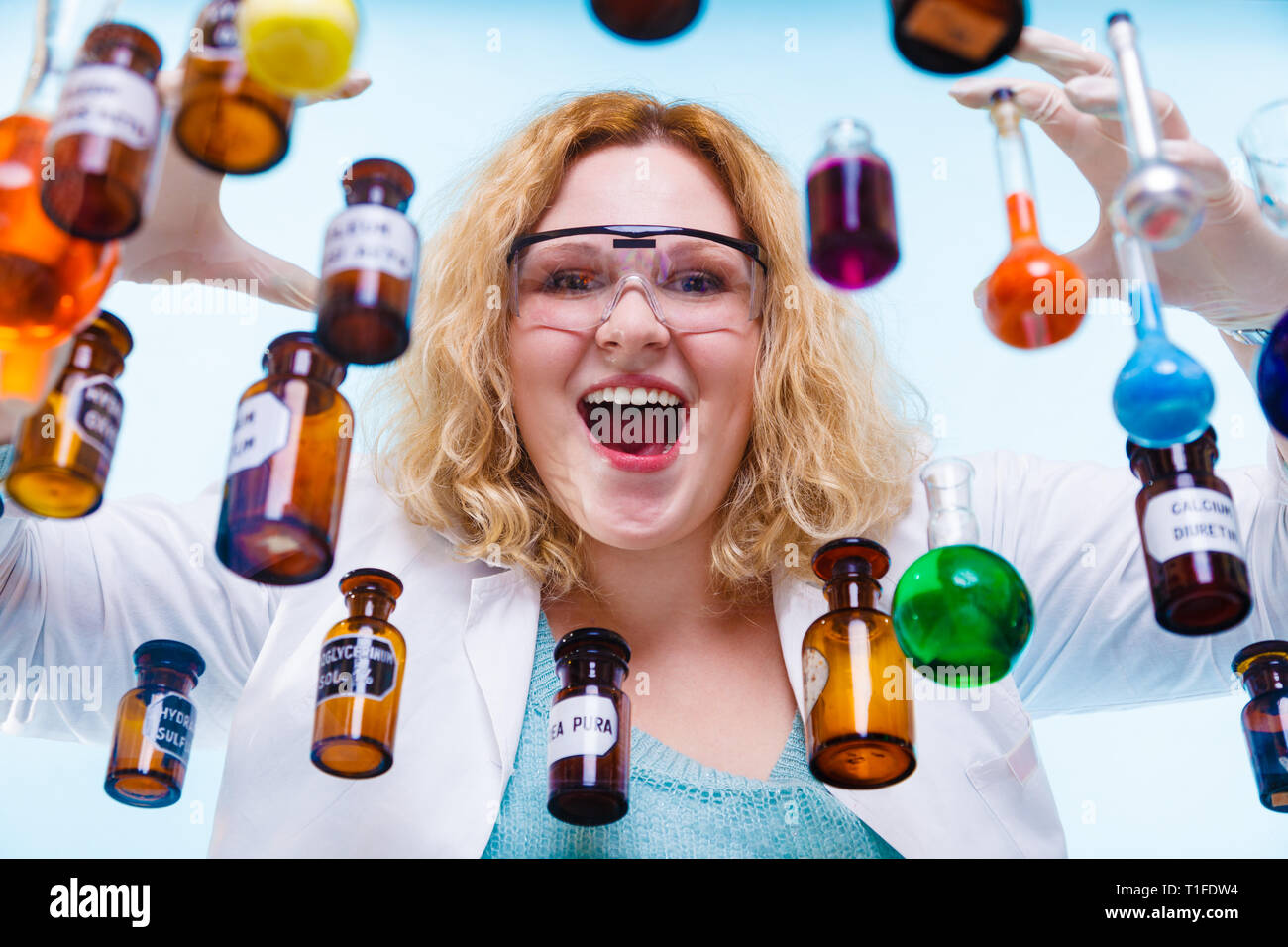 Experiment, research in progress. Chemist woman or student girl ...