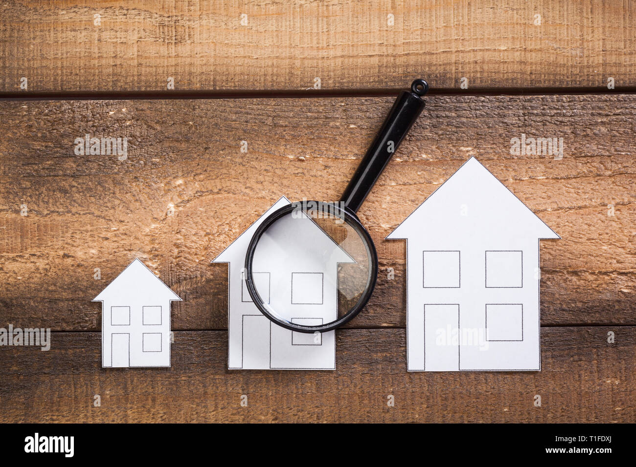 paper house with Magnifying Glass Stock Photo - Alamy