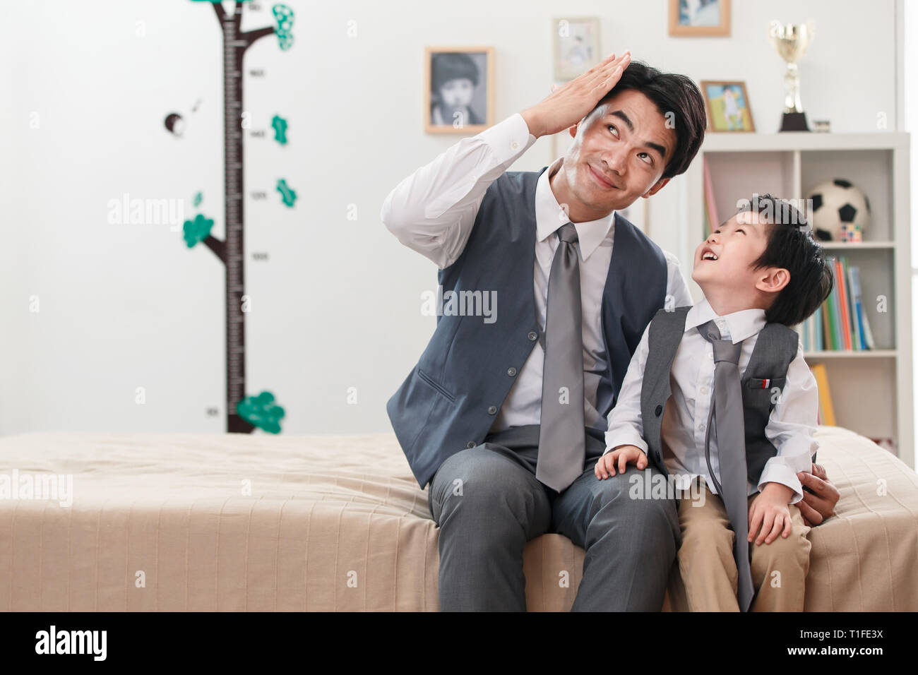 Dress up the father and son Stock Photo - Alamy