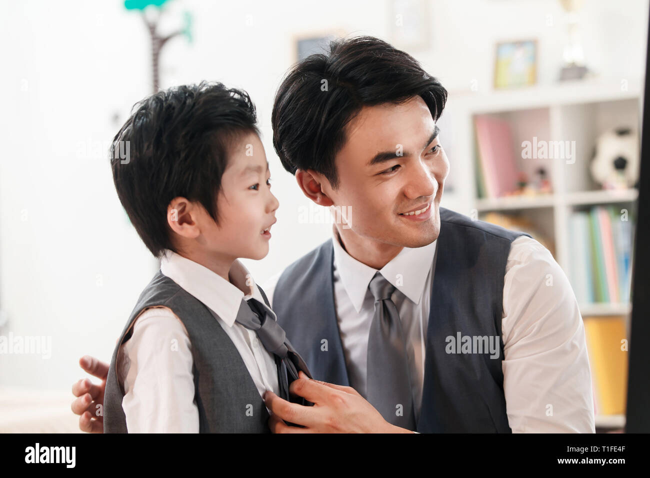 Dress up the father and son Stock Photo - Alamy