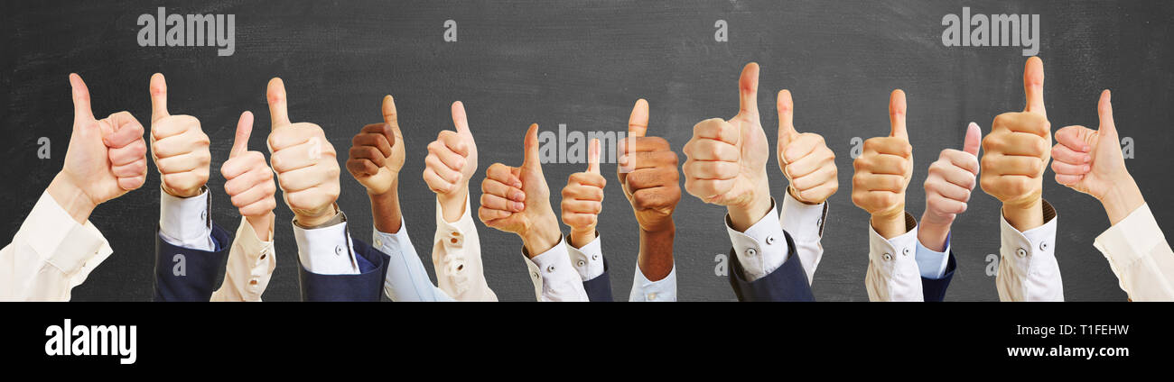 Business hands with thumbs up as success concept Stock Photo - Alamy