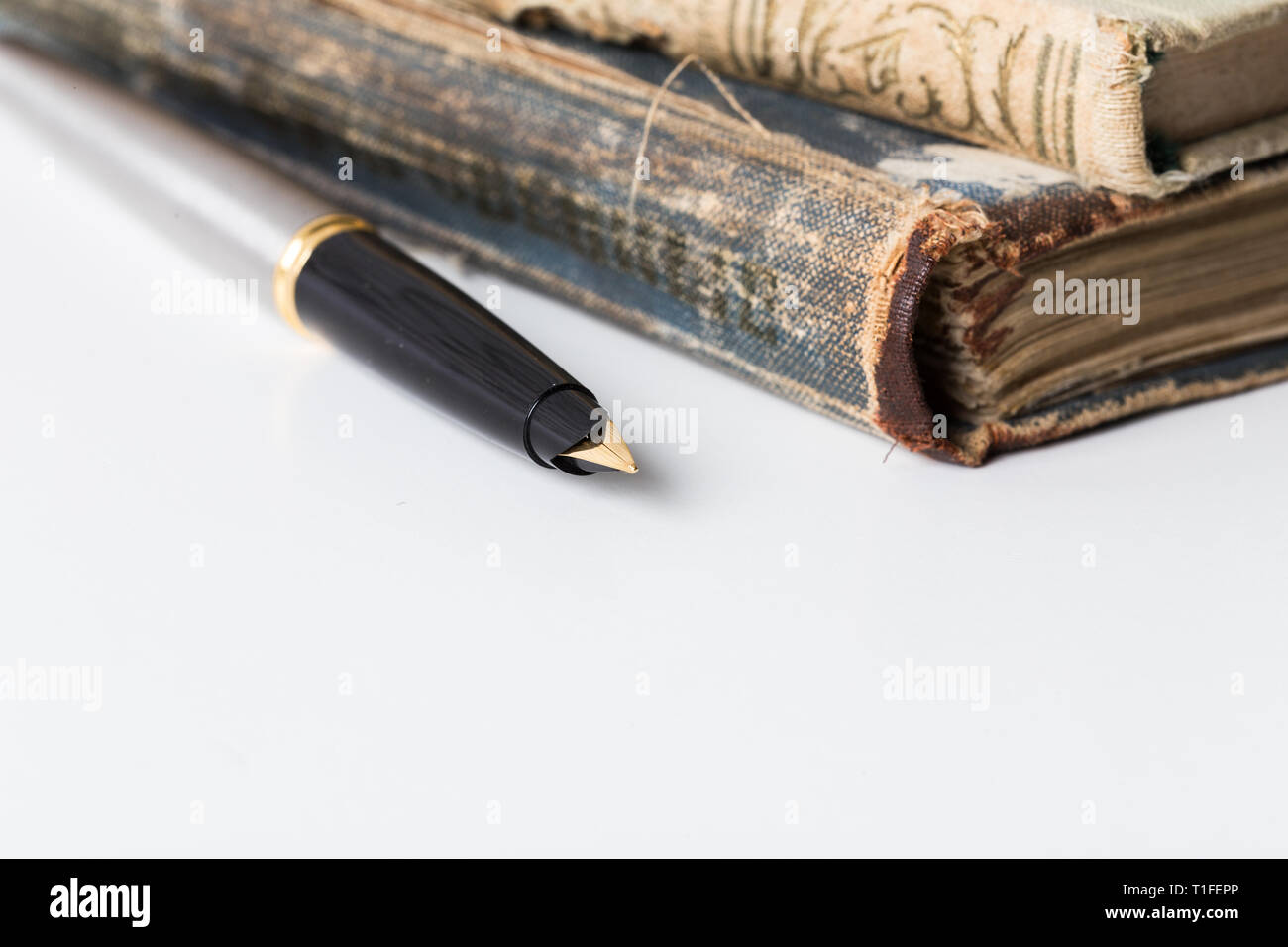 Vintage books and pen Stock Photo - Alamy