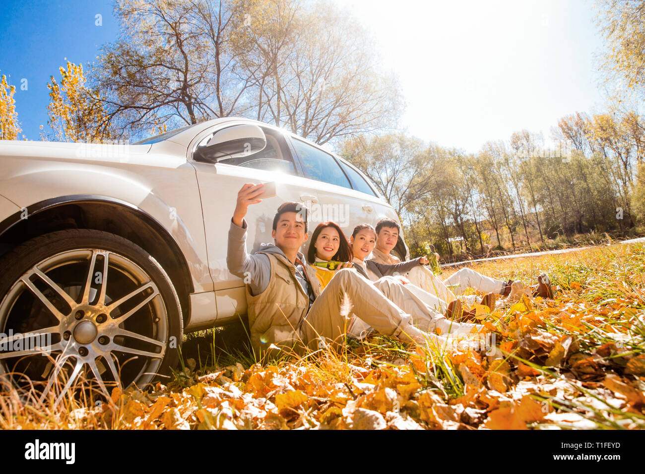Young men and women in the outdoor outing Stock Photo - Alamy