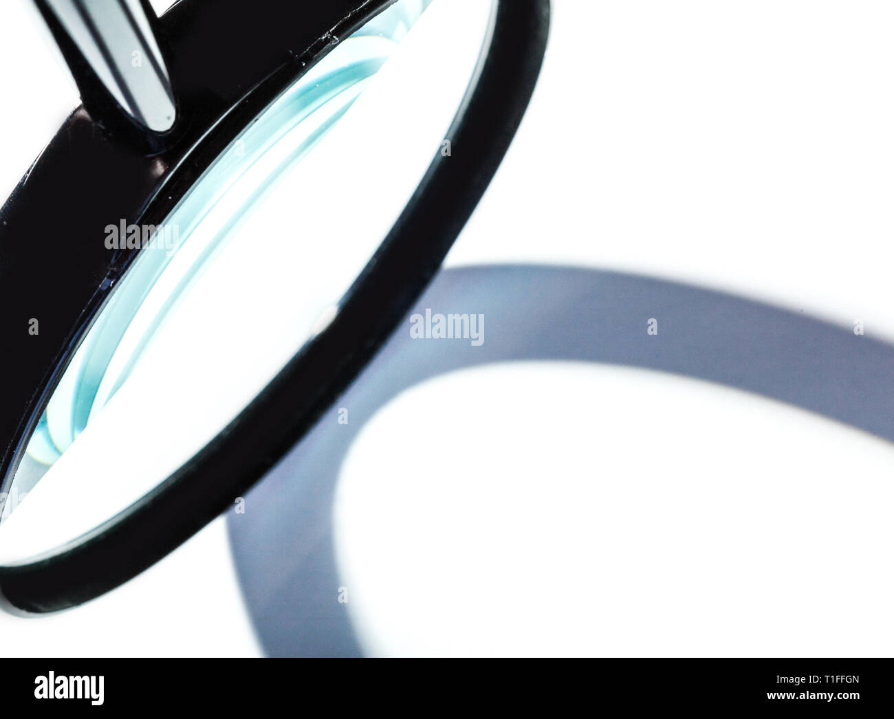 Magnifying glass isolated on white Stock Photo - Alamy