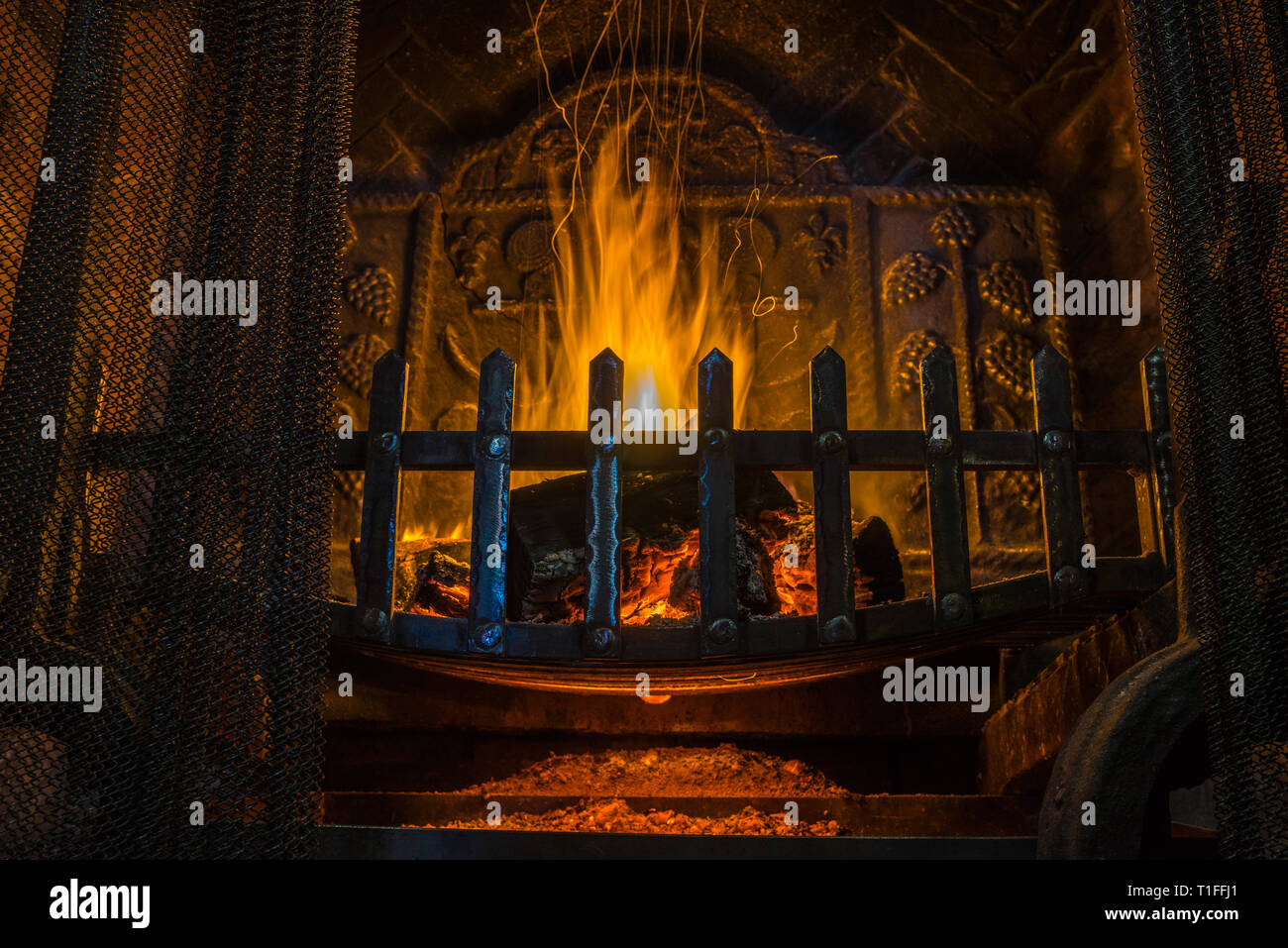 Real log fire with flames Stock Photo - Alamy