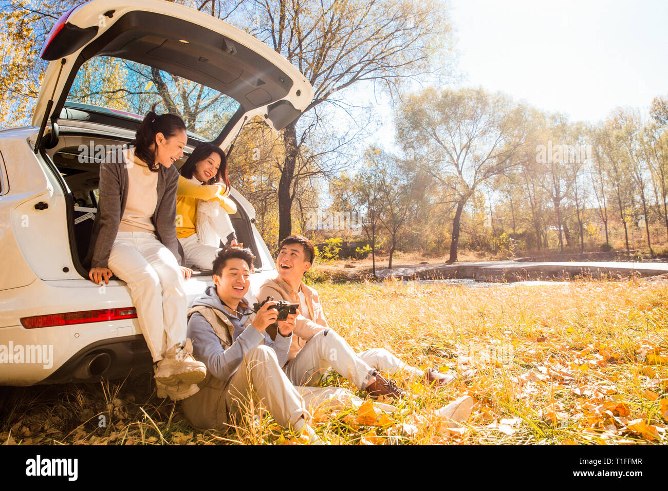 Young men and women in the outdoor outing Stock Photo - Alamy