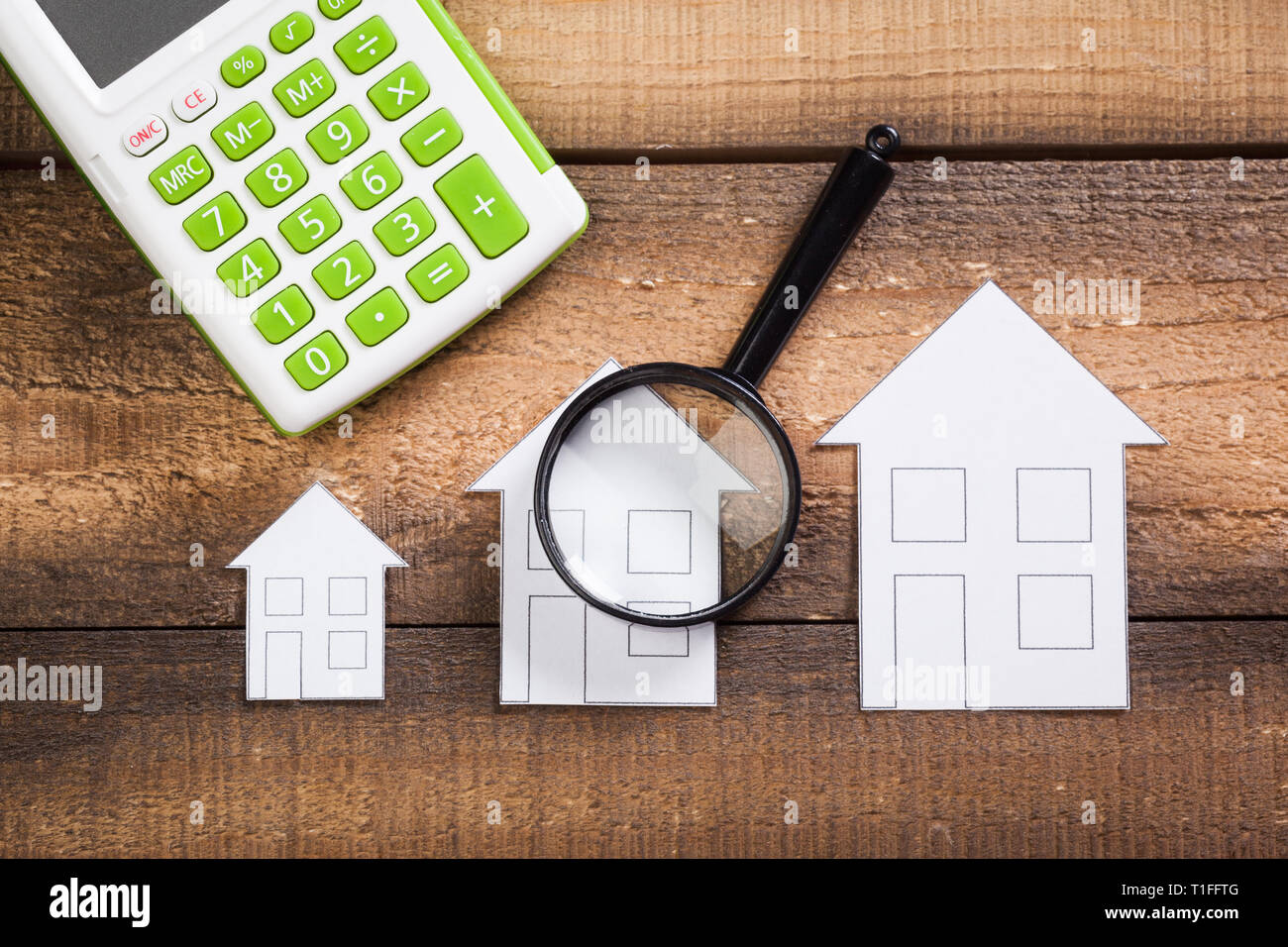 paper house with Magnifying Glass Stock Photo - Alamy