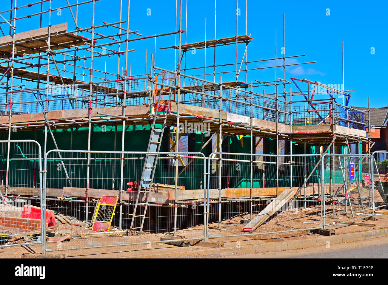 New Homes under construction. Building site with partially completed ... New Homes under construction. Building site with partially completed ...