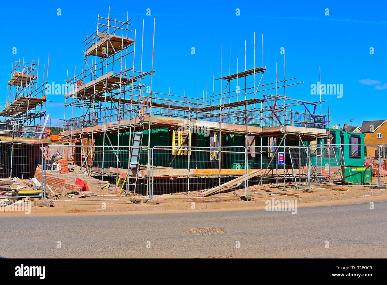 New Homes under construction. Building site with partially completed ... New Homes under construction. Building site with partially completed ...