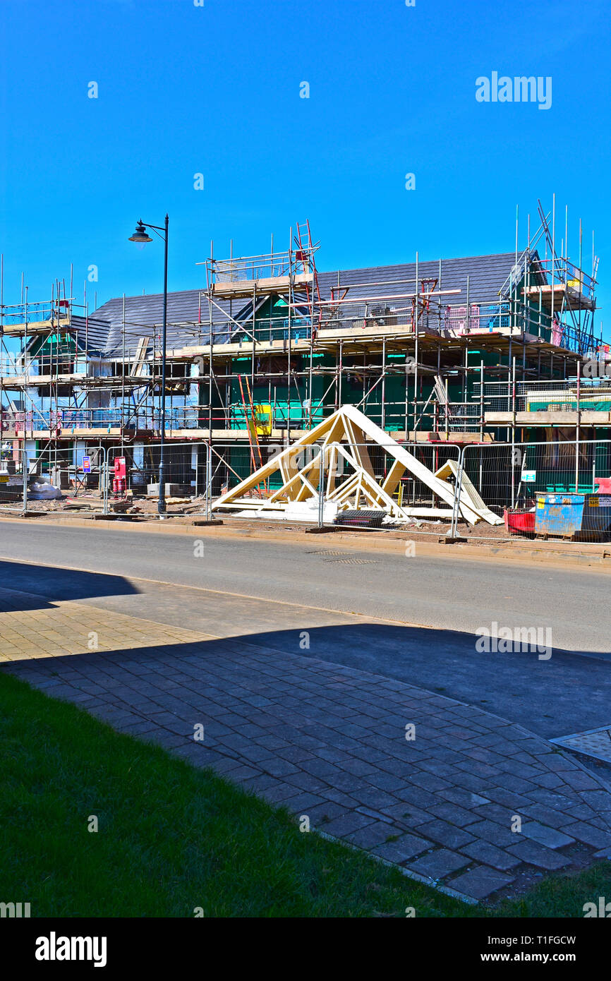 New Homes under construction. Building site with partially completed ... New Homes under construction. Building site with partially completed ...