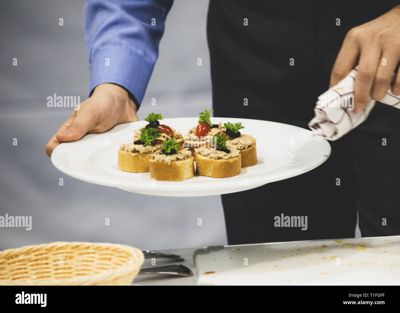 Decorating The Food In The Restaurant, Waiter is working on finishing a ...