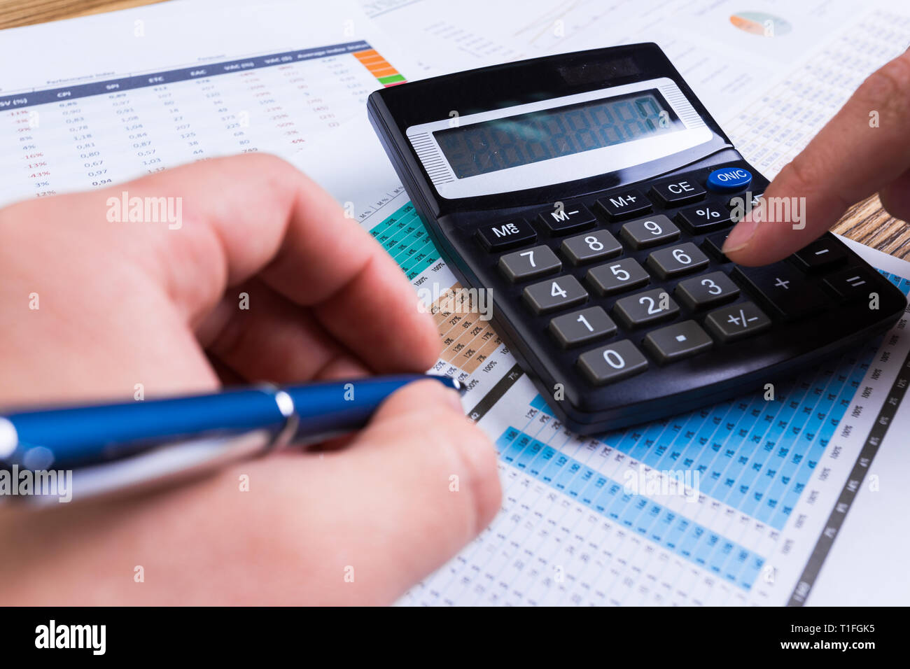 Graphs and Calculator Stock Photo - Alamy