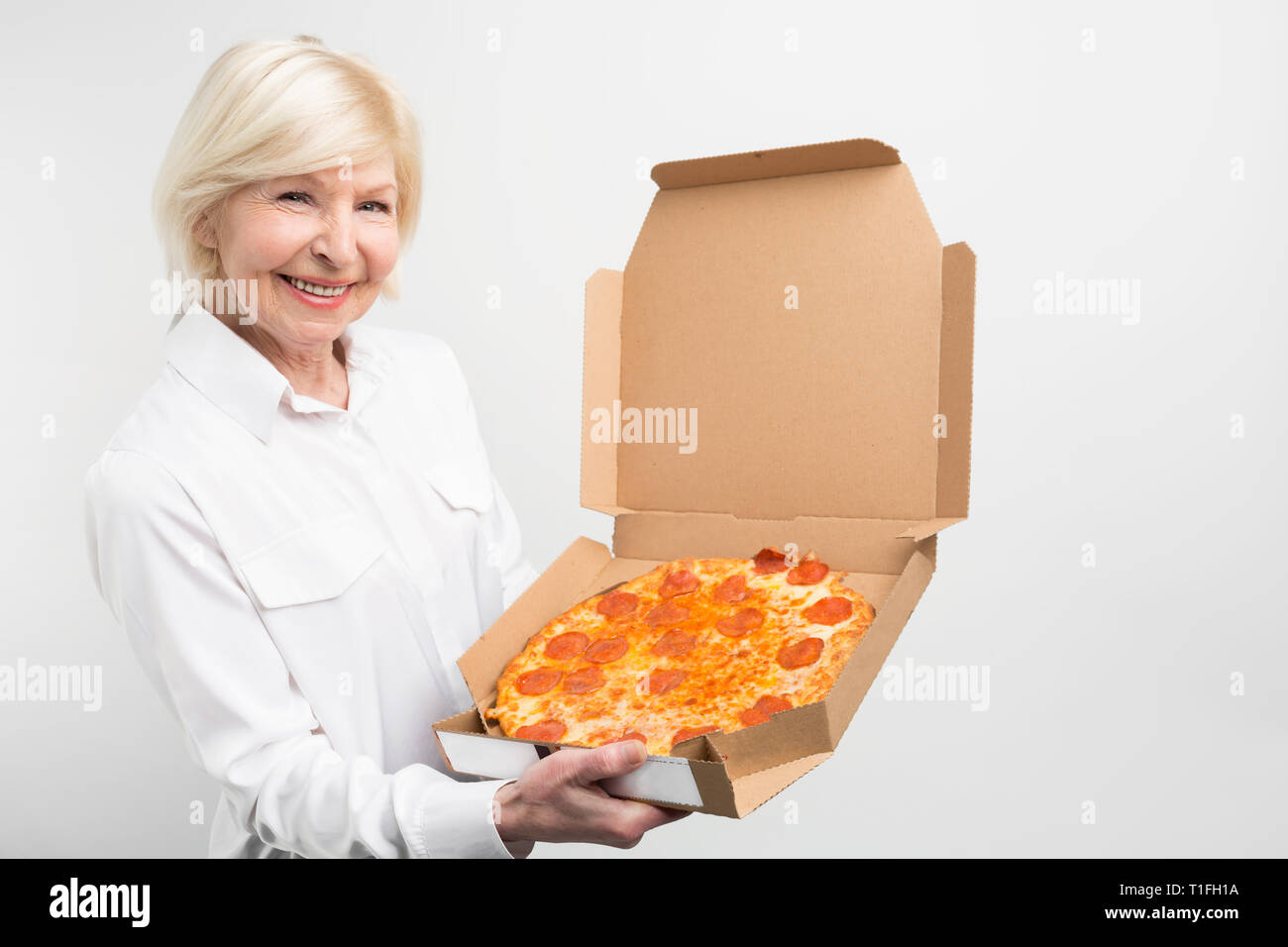 Happy grandma making pizza hi-res stock photography and images - Alamy