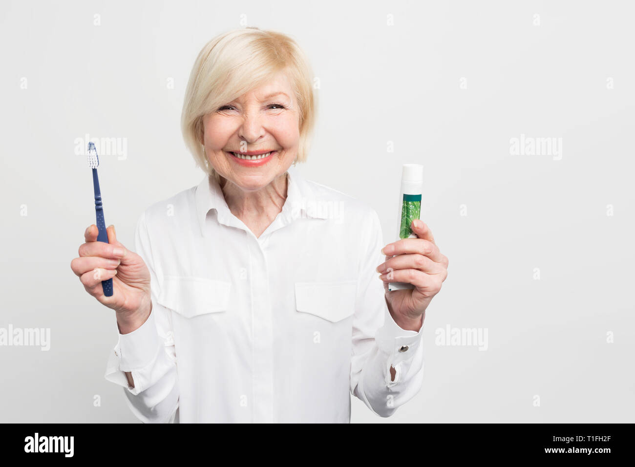 Mature lady cleaning teeth hi-res stock photography and images - Alamy