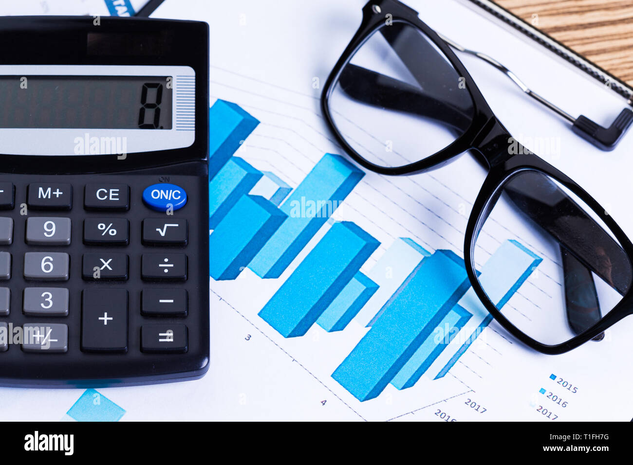 Graphs and Calculator Stock Photo - Alamy