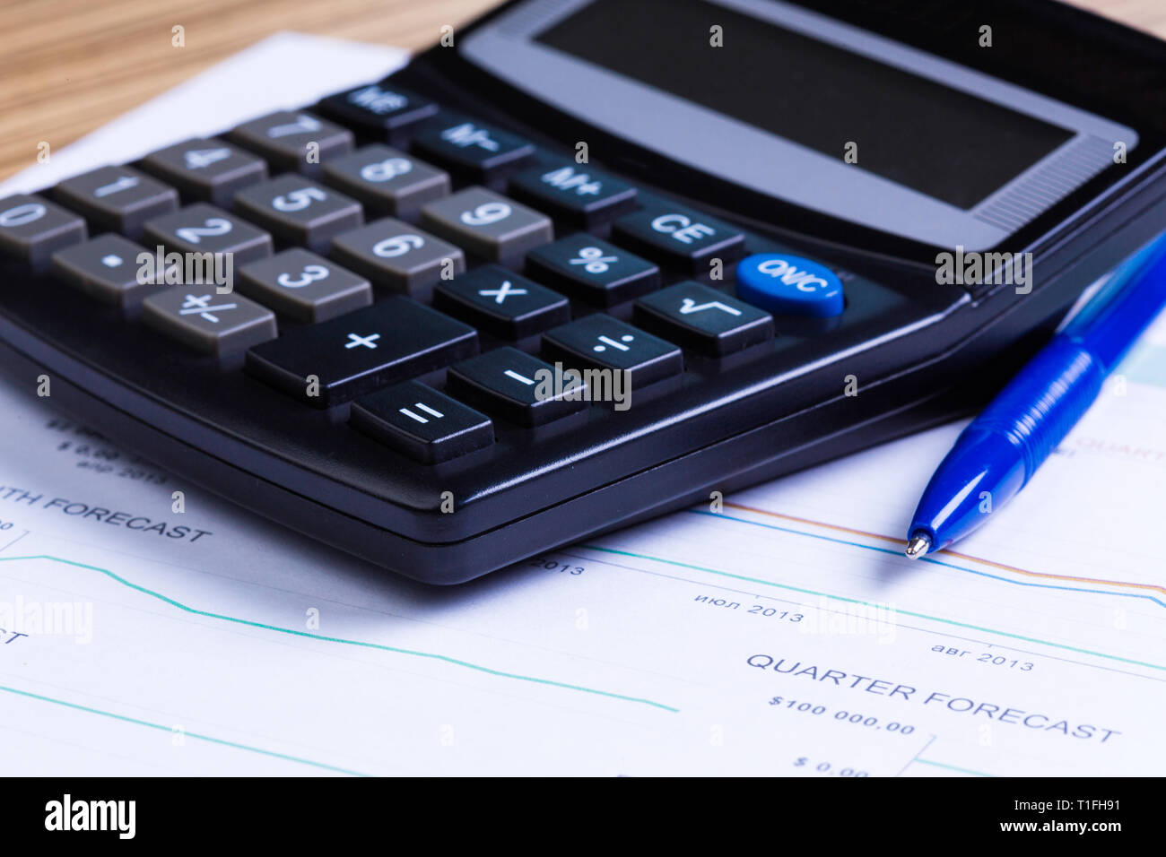 Graphs and Calculator Stock Photo - Alamy