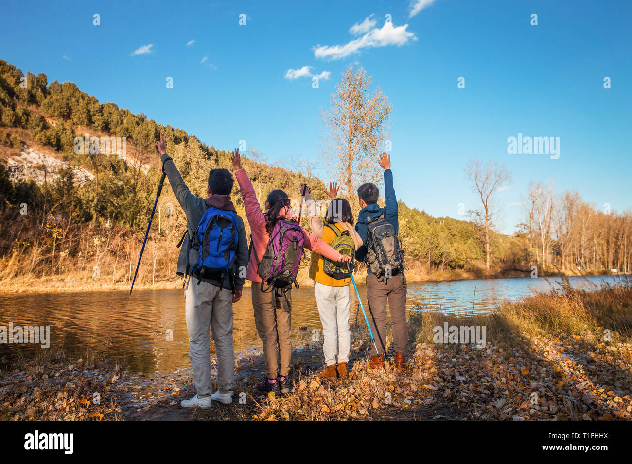 Young men and women outdoor outing Stock Photo - Alamy