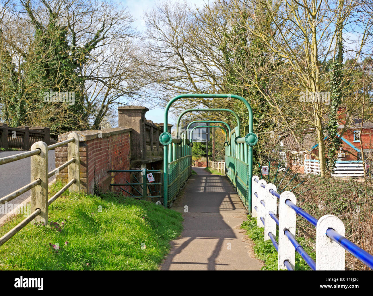 A pedestrian footbridge by the side of the B1150 road crossing the ...
