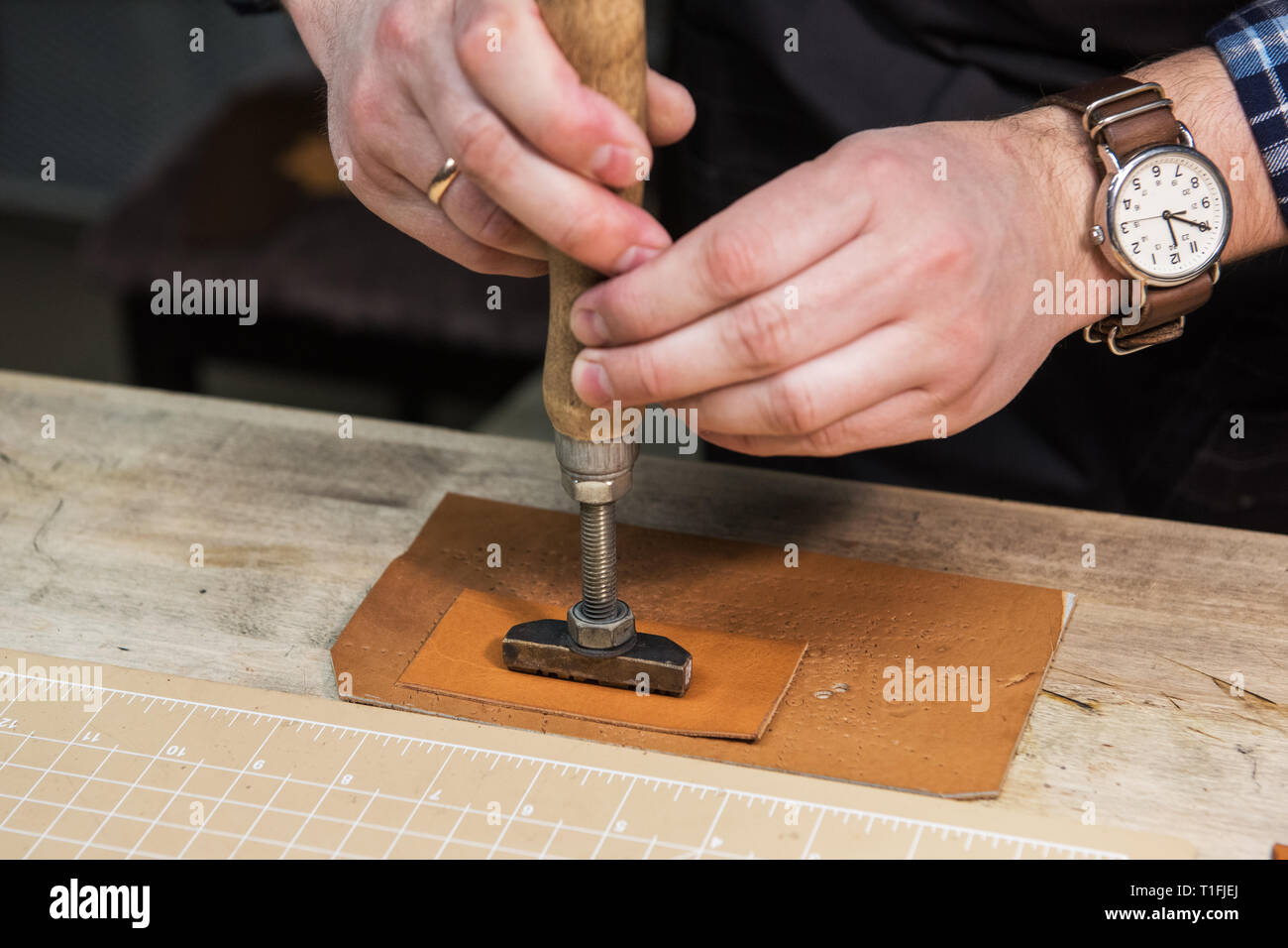 Concept of handmade craft production of leather goods Stock Photo - Alamy