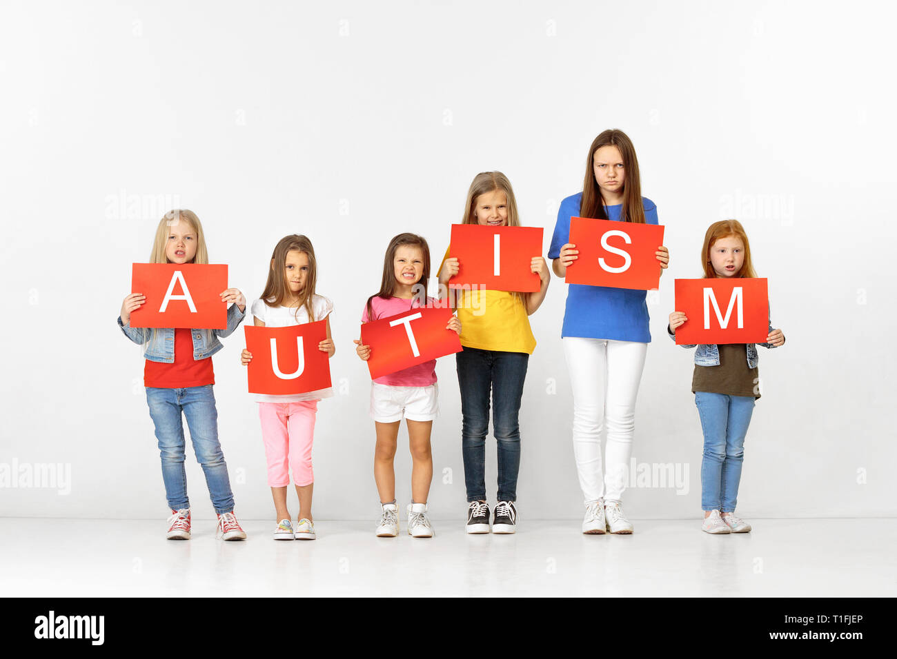 Autism - dont be scared to be different. Group of angry sad children ...