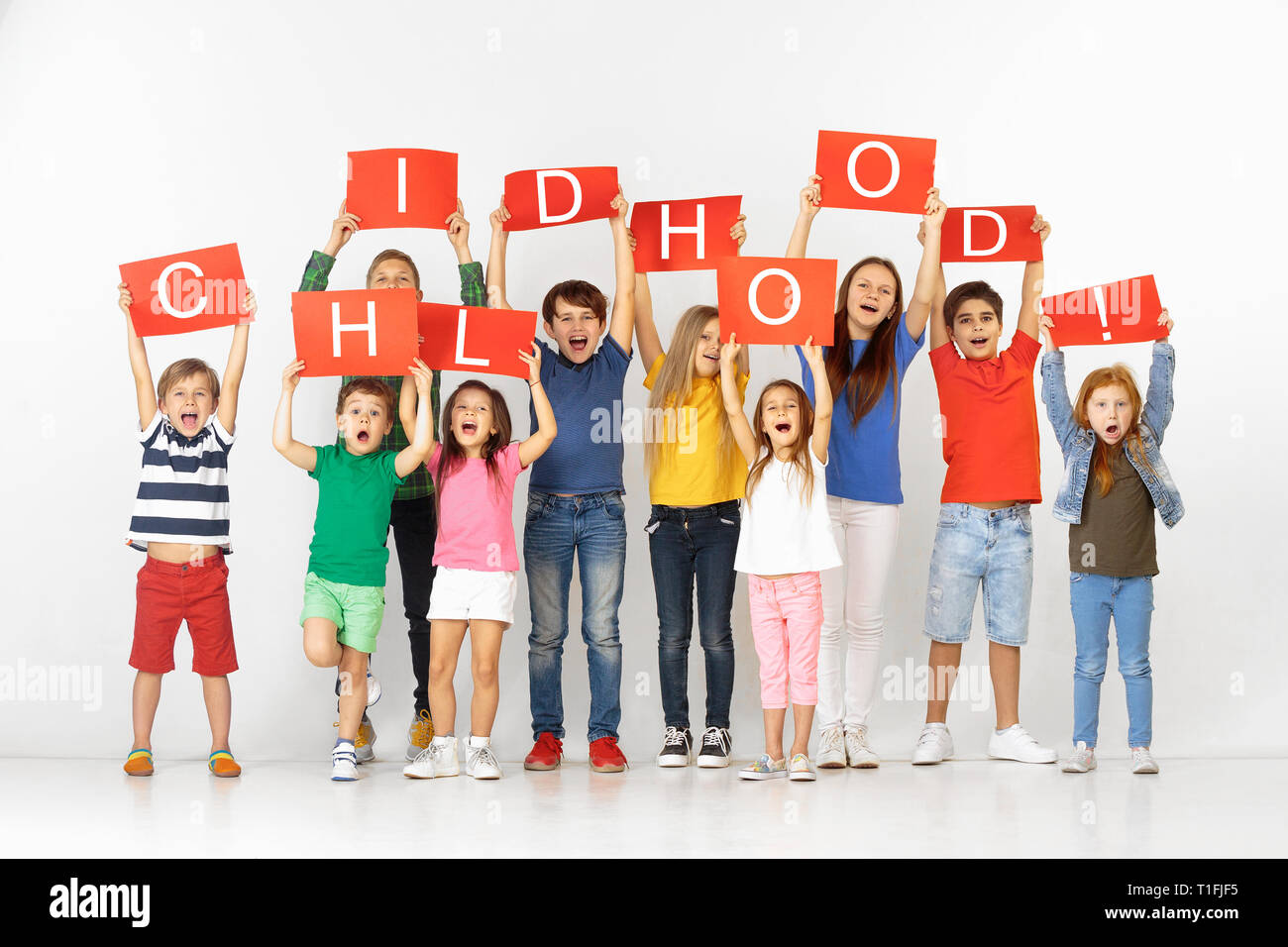 Childhood is so sweet time of life. Group of happy screaming children ...
