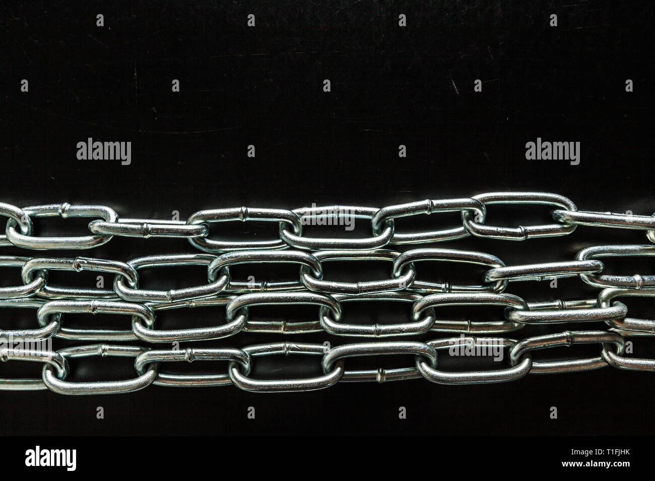 Strong chain black background Stock Photo - Alamy